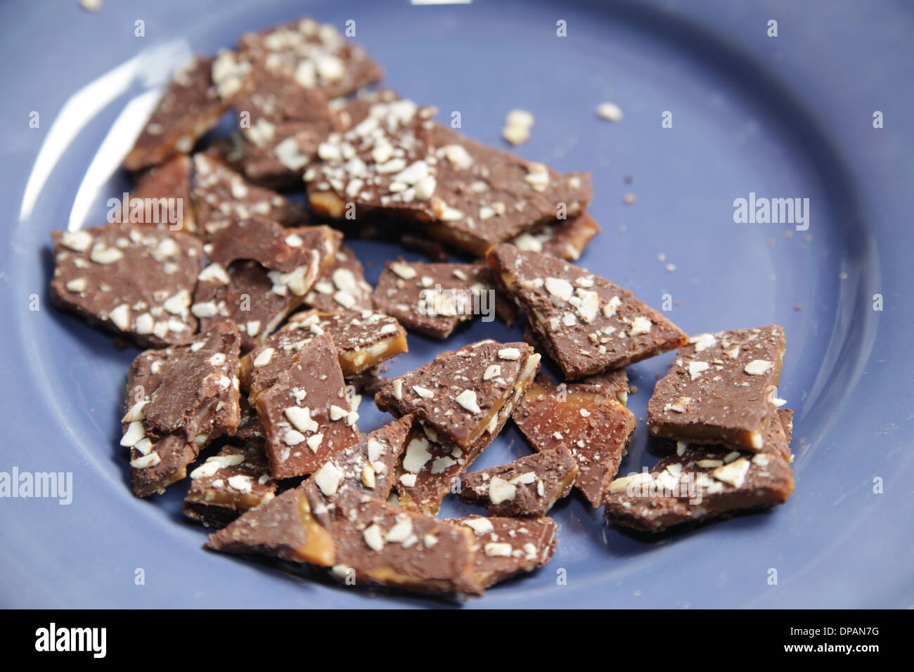 homemade toffee on a blue plate Stock Photo - Alamy