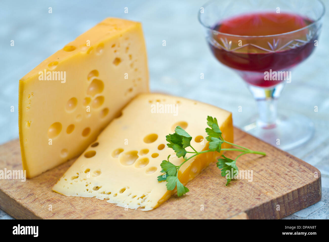 Emental cheese and wine shoot with short DOF Stock Photo - Alamy