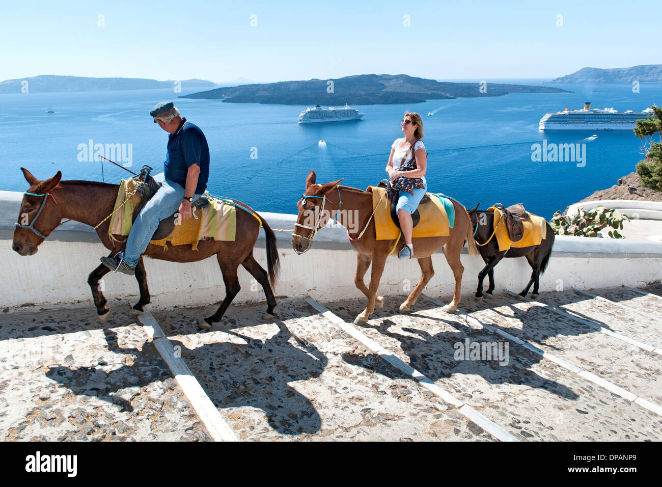 Tourist riding donkeys santorini hi-res stock photography and images ...
