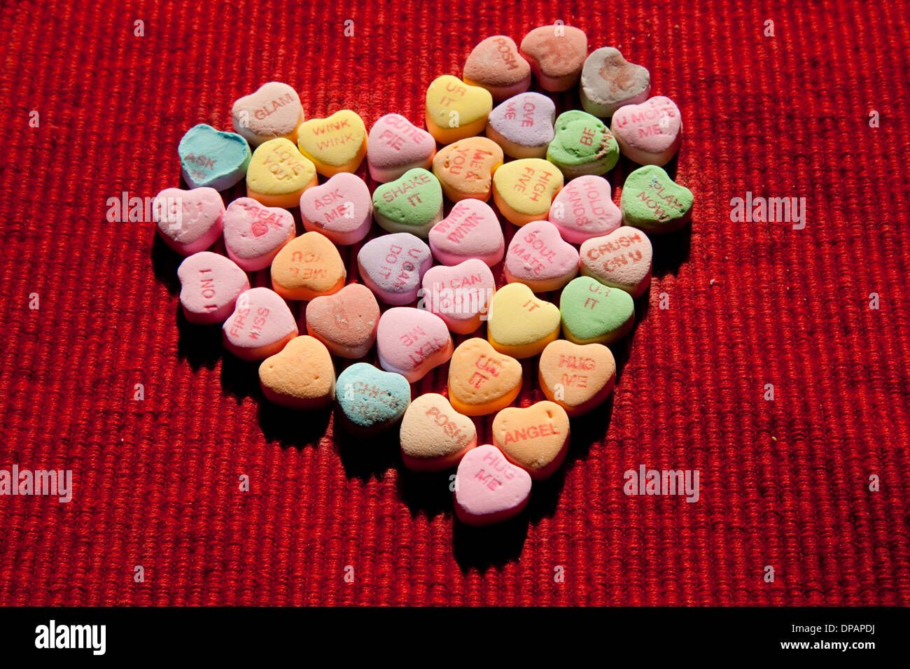 Conversation hearts in a large heart shape Stock Photo - Alamy