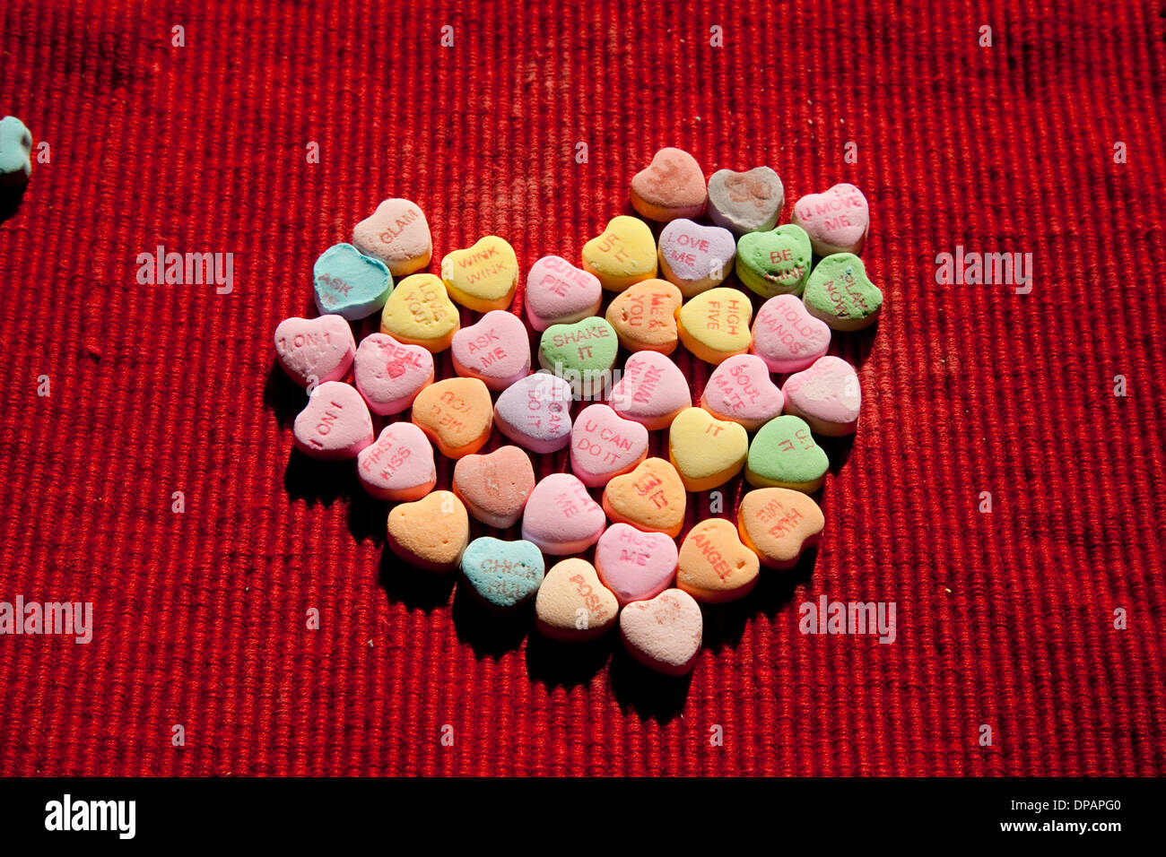 Conversation hearts in a large heart shape Stock Photo - Alamy