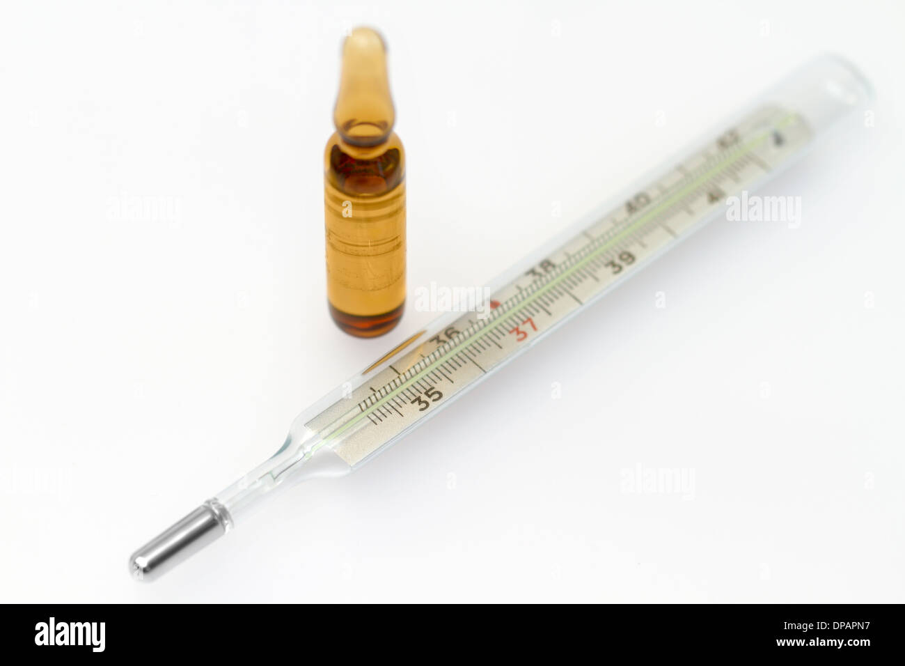 Thermometer with capsule on white background. High temperature Stock ...