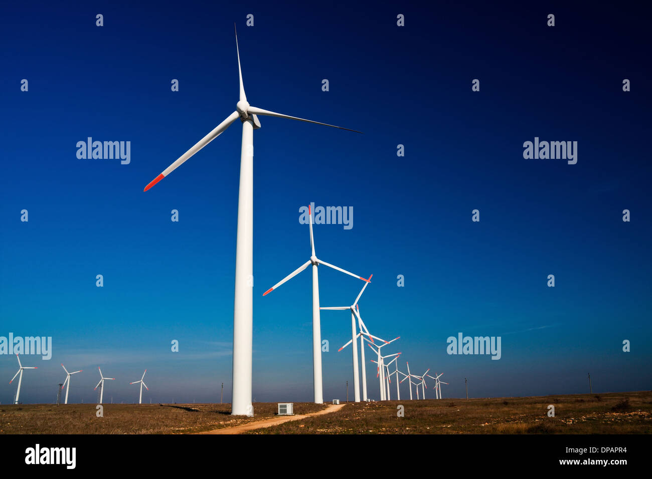 Wind power generators on blue sky Stock Photo - Alamy