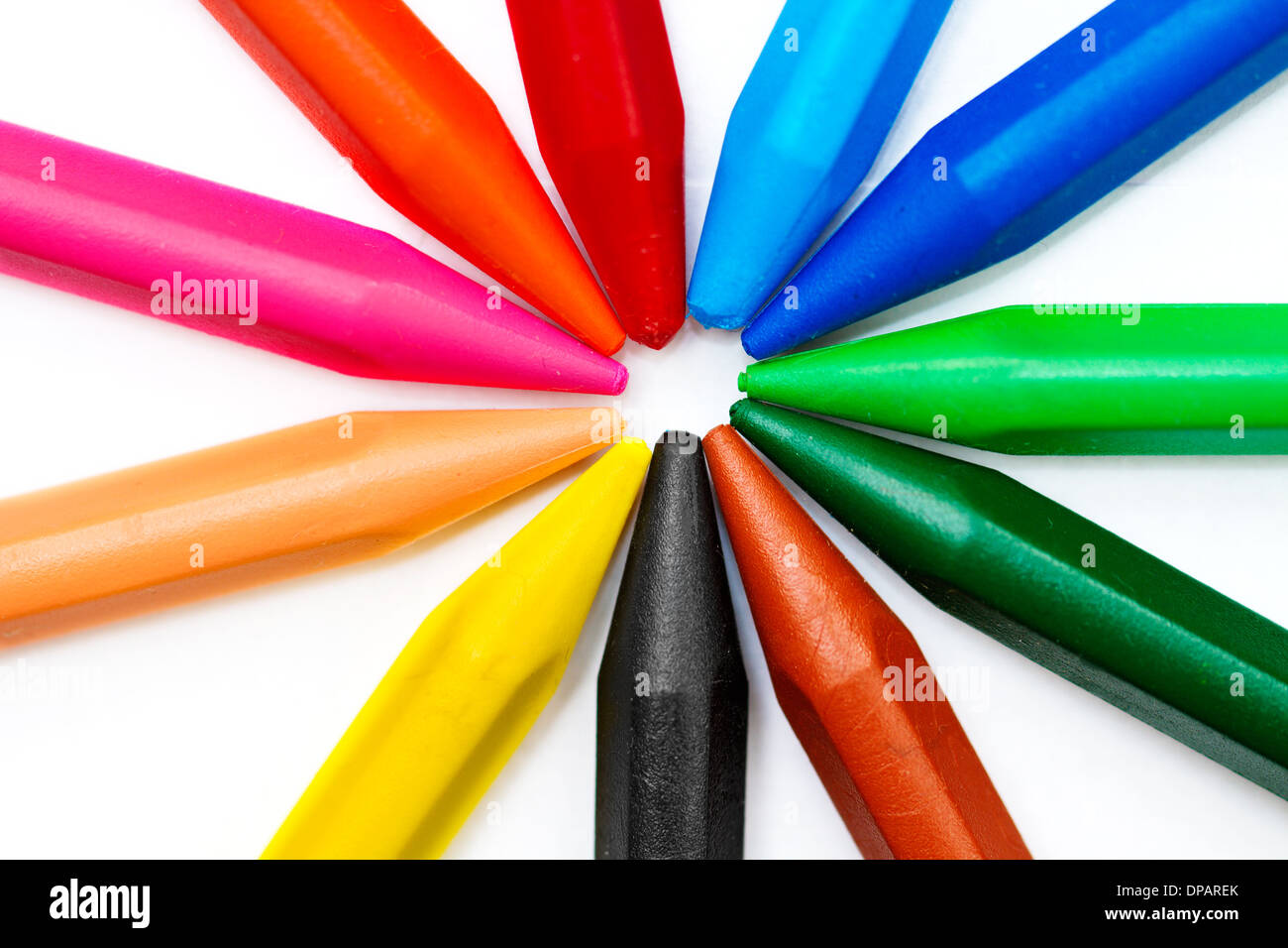 Colored pencils in round over white background Stock Photo - Alamy