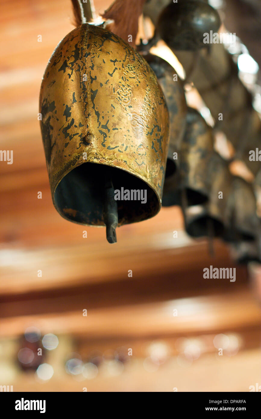 Old rural village bell. Old brass village bell for cows. Picture is ...