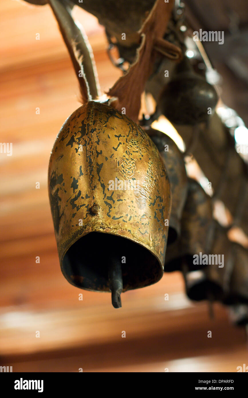 Old rural village bell. Old brass village bell for cows. Picture is ...