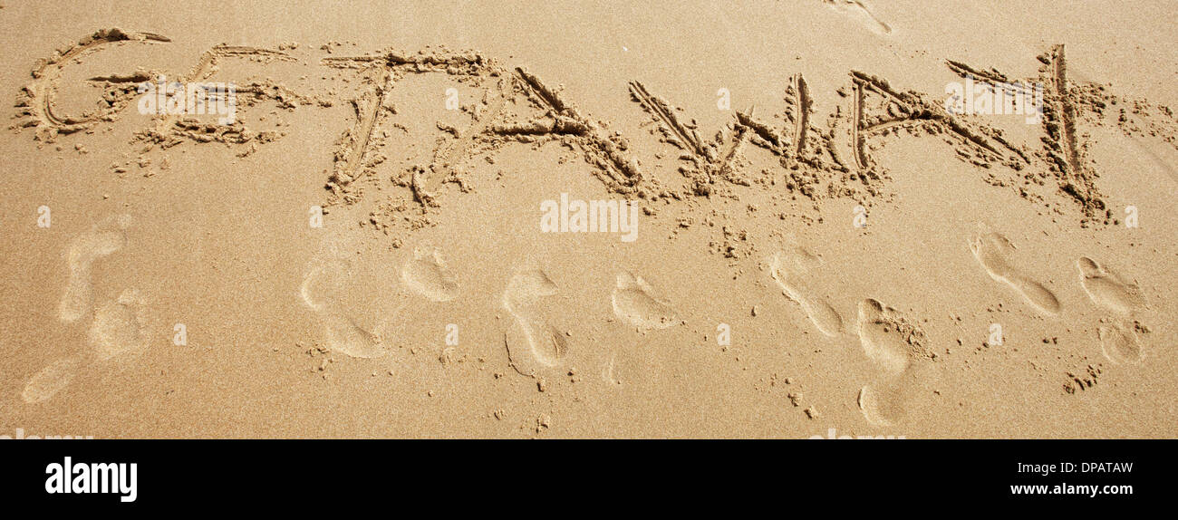 Message or greeting written in sand at the beach Stock Photo - Alamy