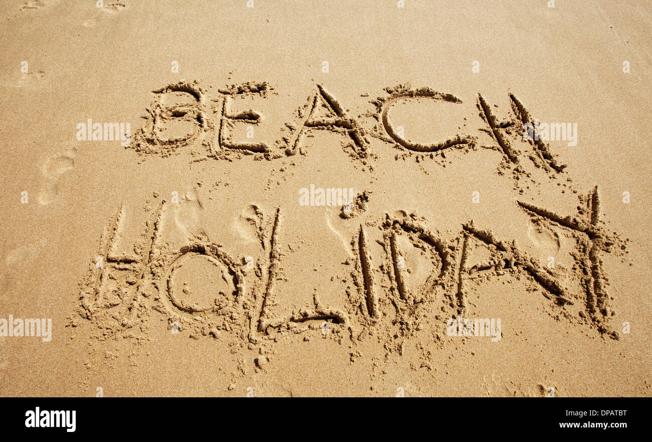 Message or greeting written in sand at the beach Stock Photo - Alamy