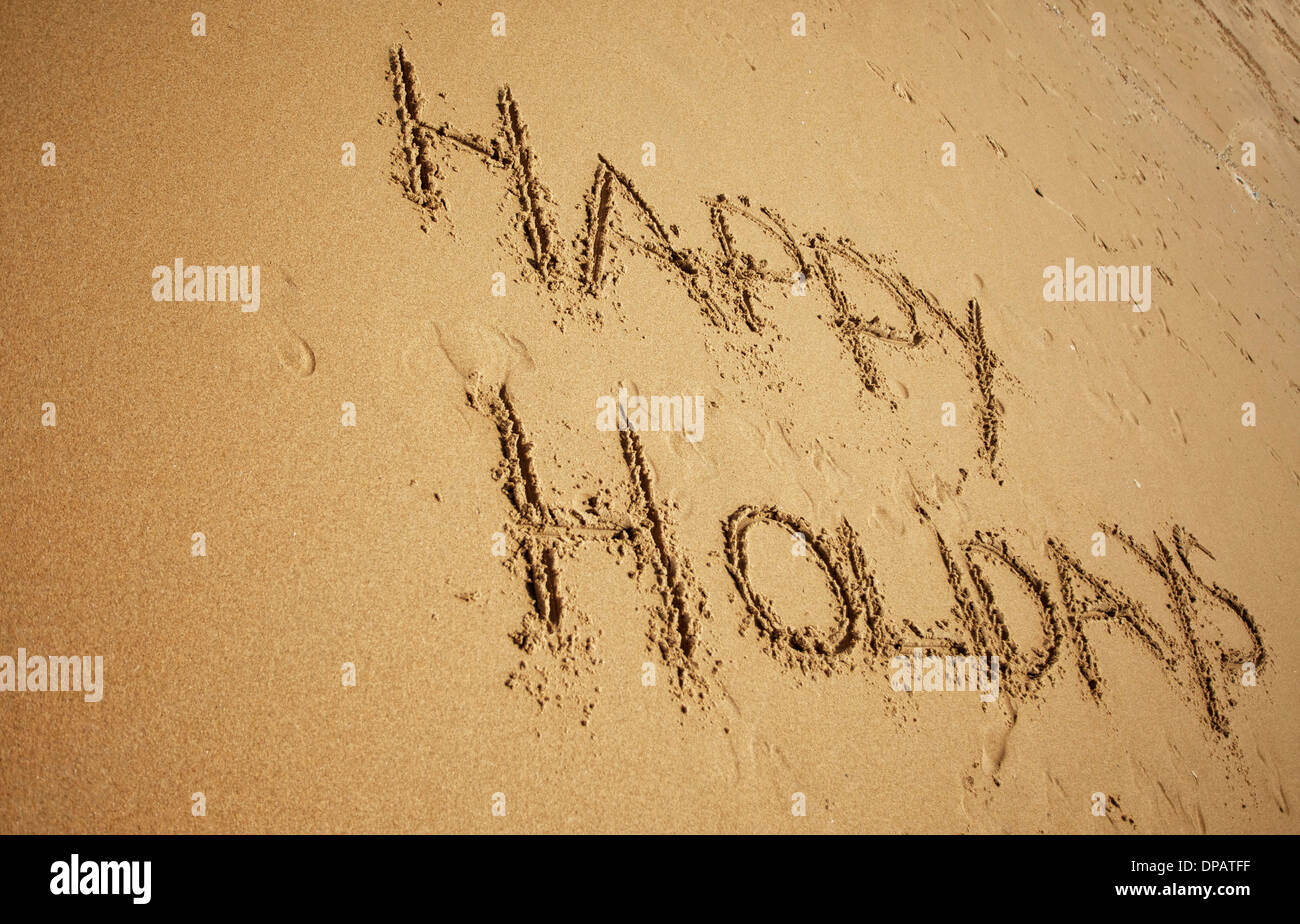 Holidays written in sand hi-res stock photography and images - Alamy