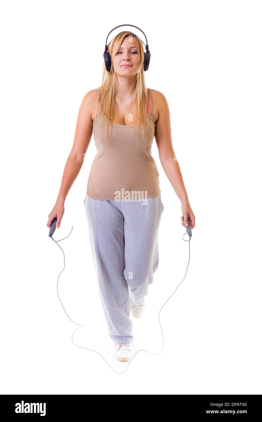 Sport girl doing exercise with skip jump rope Stock Photo - Alamy