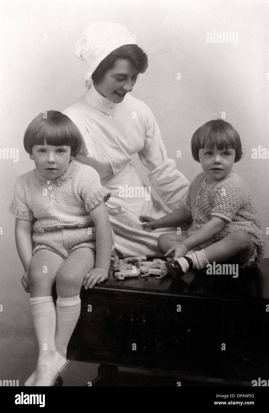 NANNY WITH TWO CHILDREN Stock Photo - Alamy