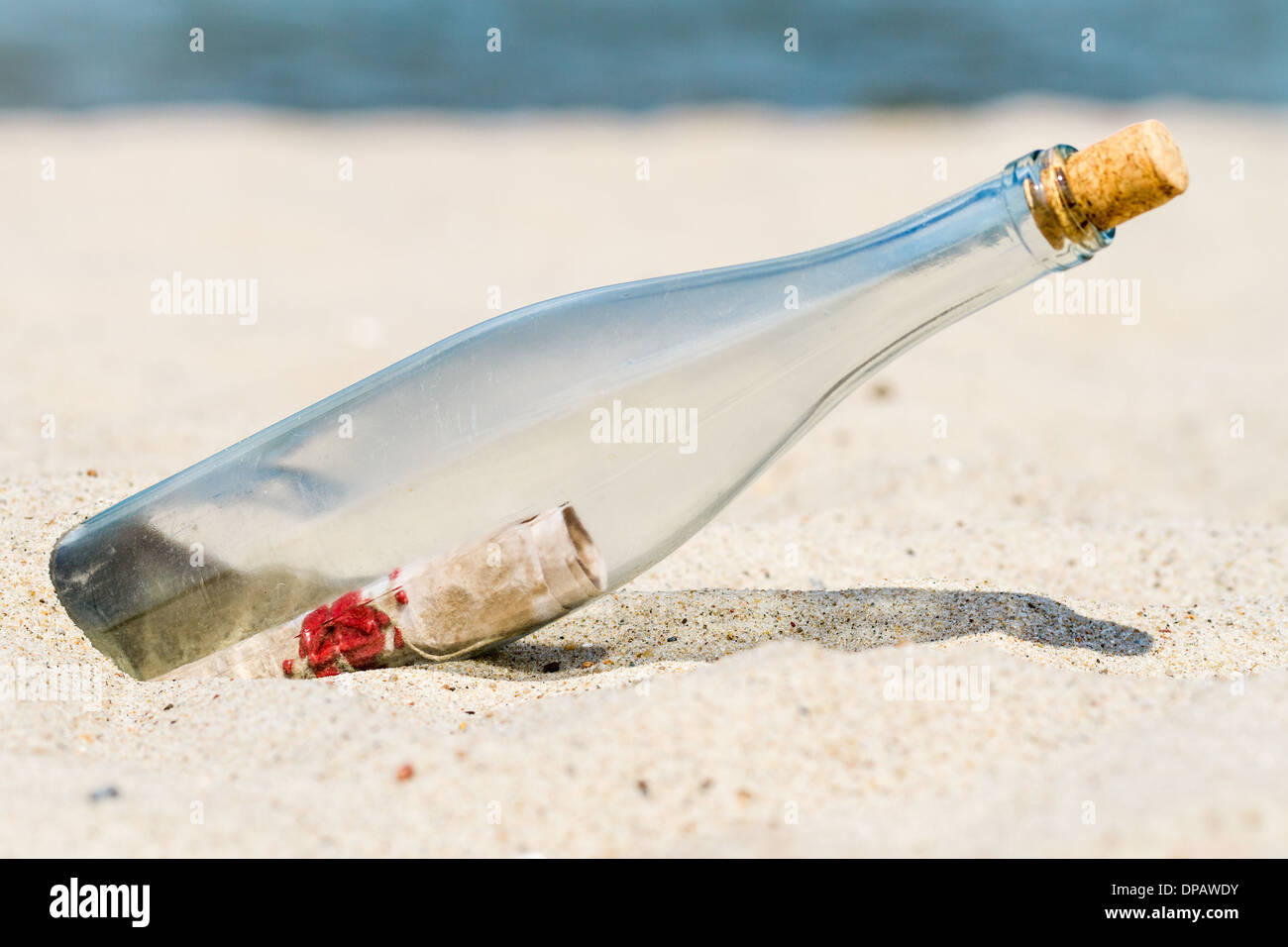 Message in a bottle on the beach Stock Photo - Alamy