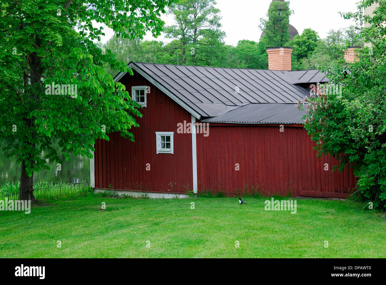 House by the river Stock Photo - Alamy
