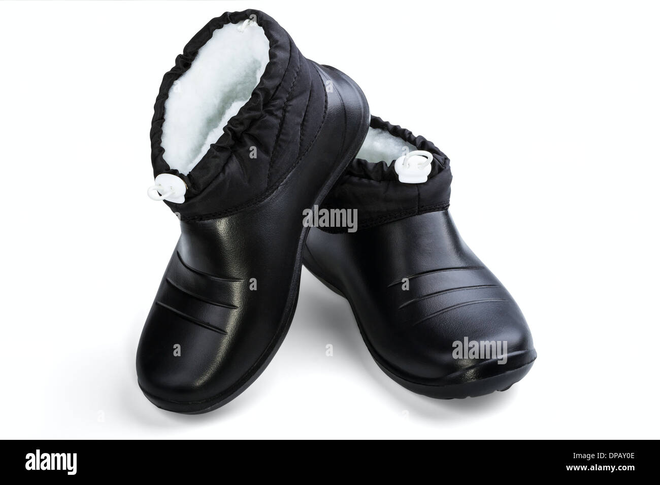 Black rubber female shoes isolated on white background Stock Photo - Alamy