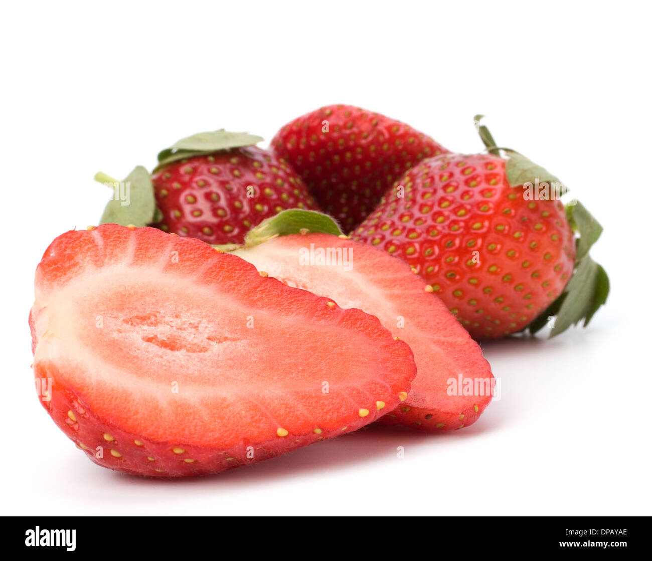 Halved strawberries isolated on white background Stock Photo - Alamy