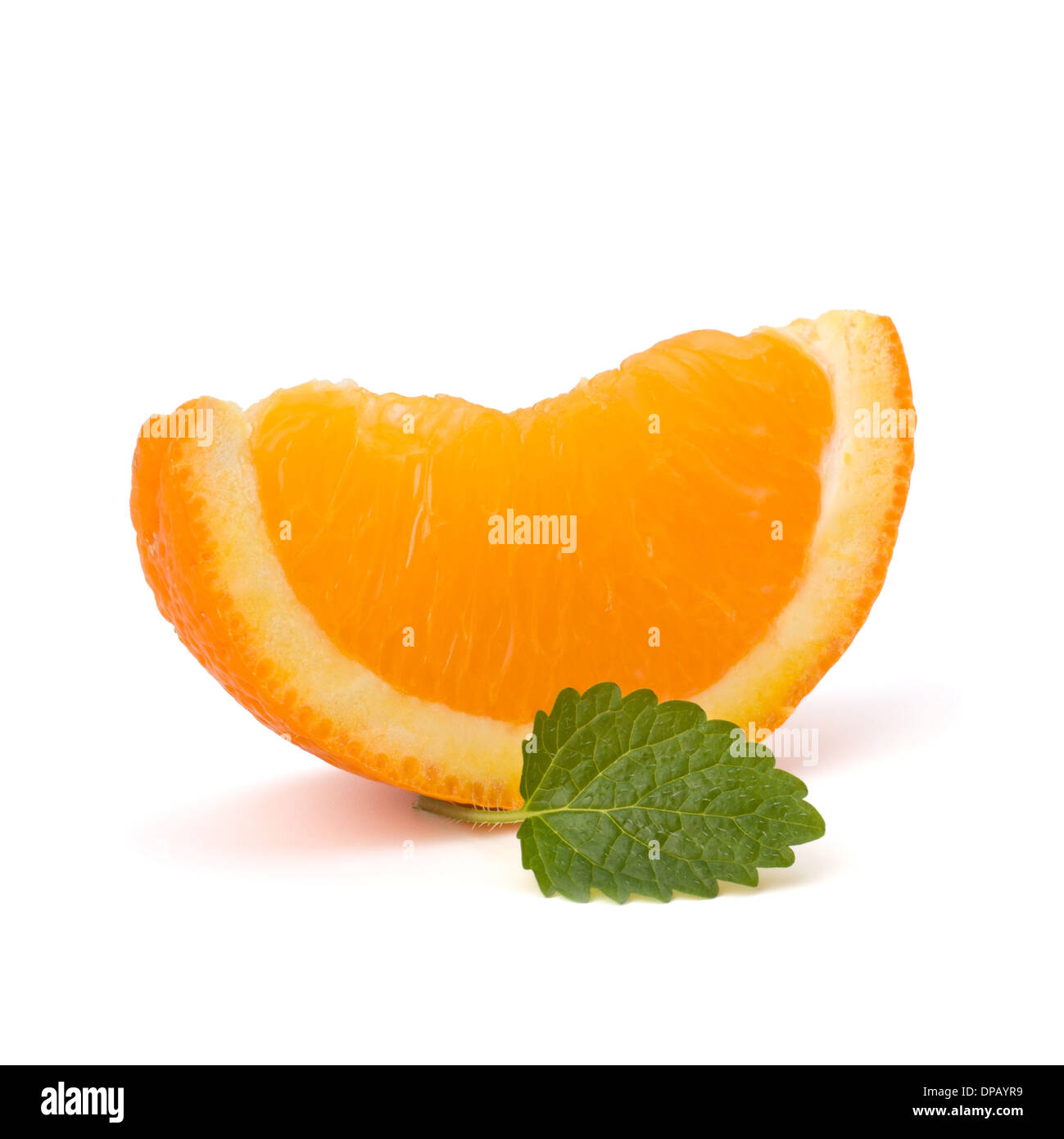 Orange fruit segment and citron mint leaf isolated on white background ...