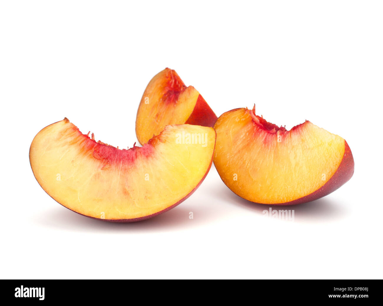 Nectarine fruit segments isolated on white background Stock Photo - Alamy