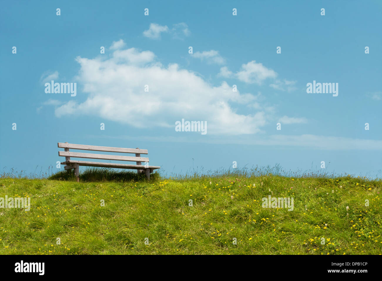 Bench on sky background. Tranquil scene Stock Photo - Alamy