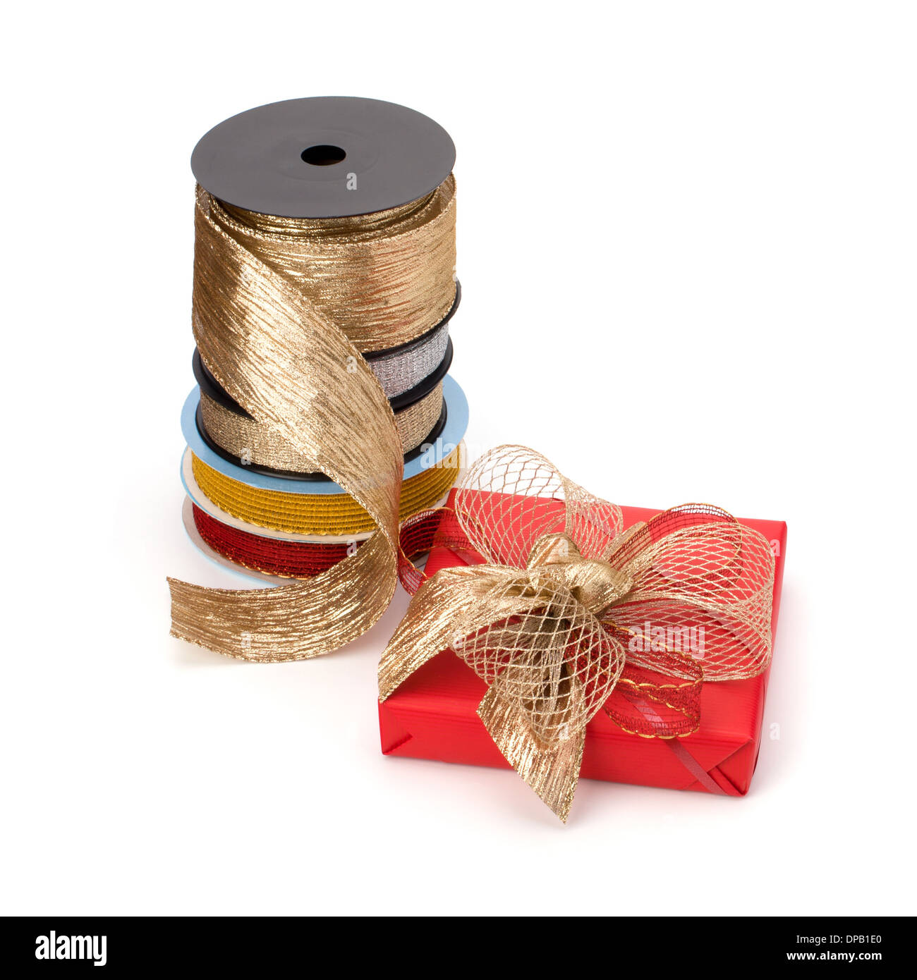 Festive gift box and wrapping ribbons isolated on white background ...