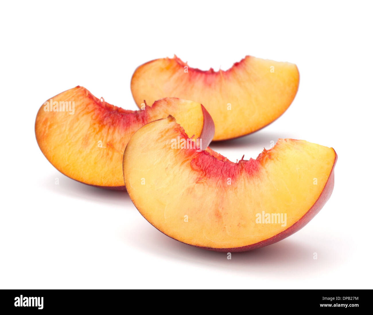 Nectarine fruit segments isolated on white background Stock Photo - Alamy