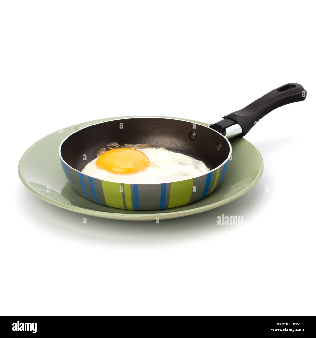 Fried egg on pan over white background Stock Photo - Alamy