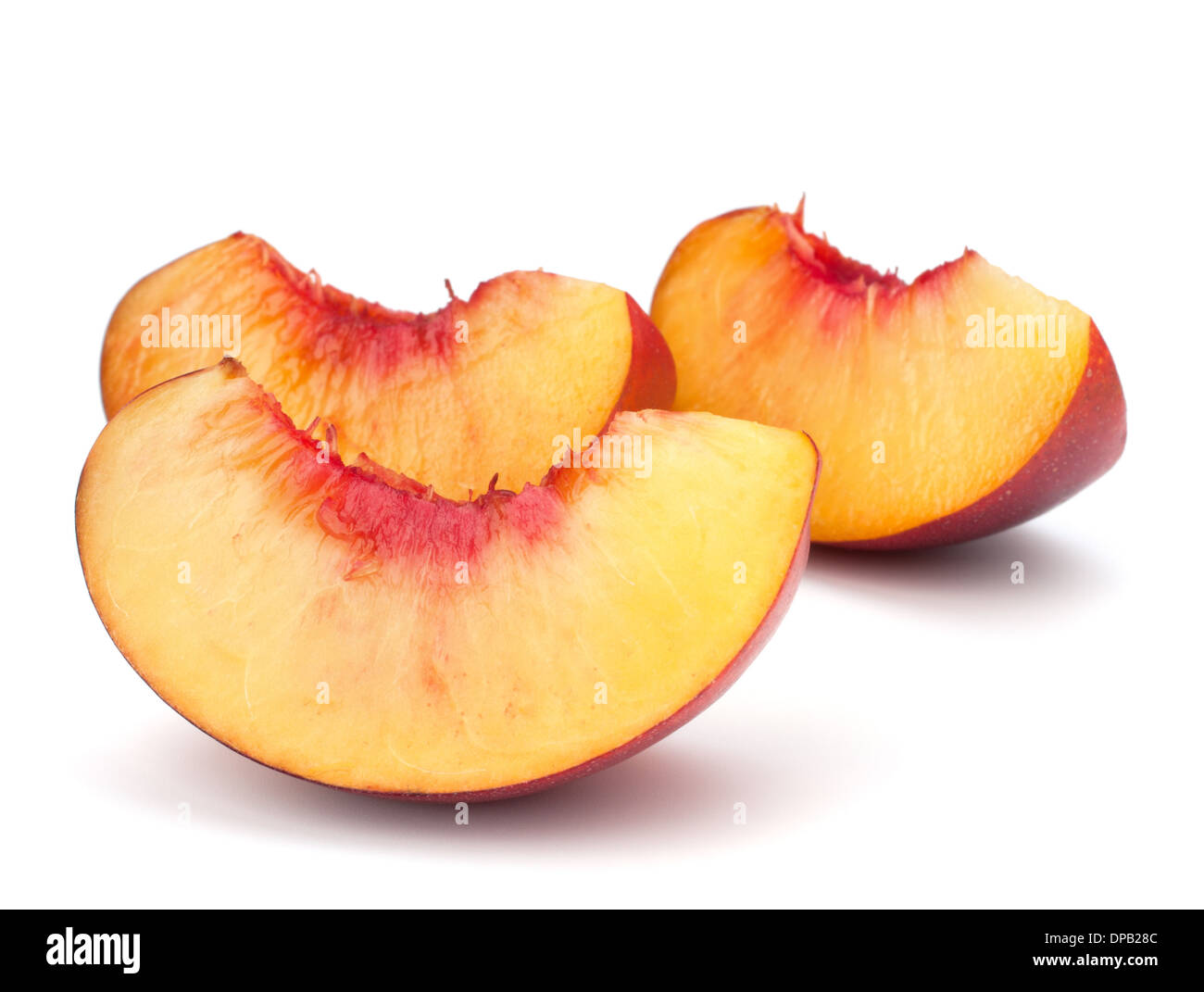 Nectarine fruit segments isolated on white background Stock Photo - Alamy