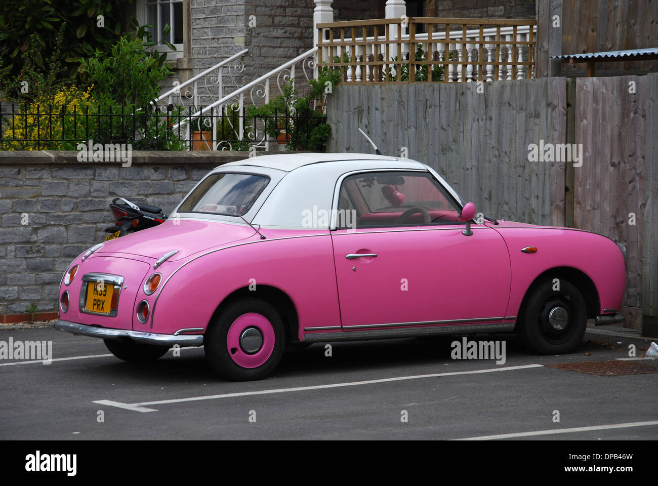 Pink Nissan Figaro, Glastonbury Somerset UK Stock Photo - Alamy