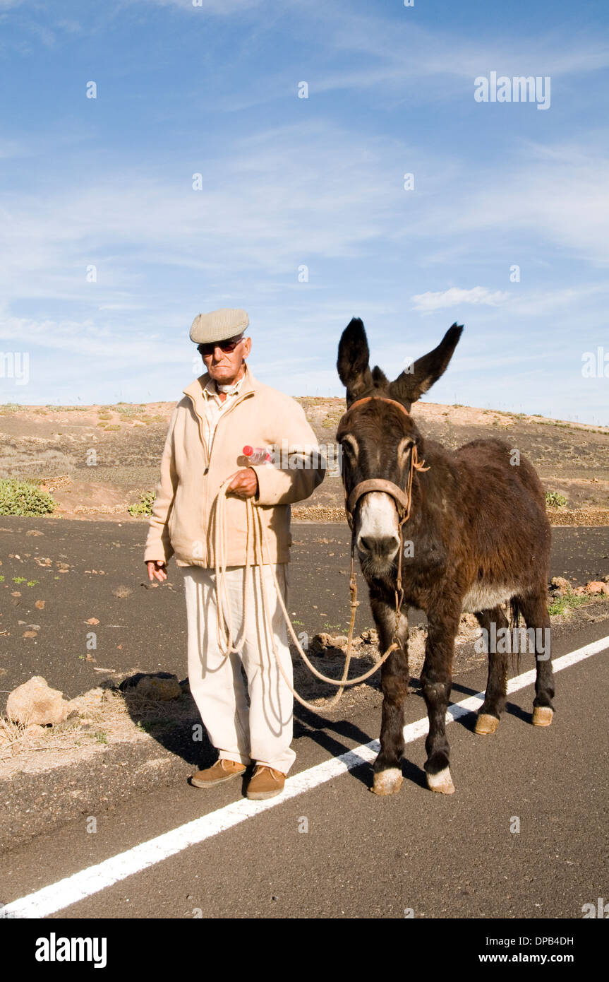 old man walking a donkey donkeys lanzarote canaries islands canary ...