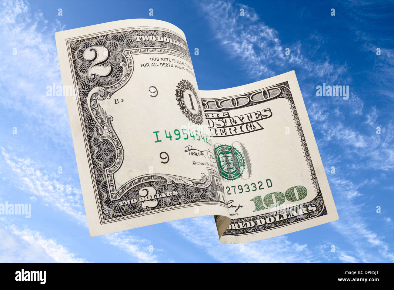 Dollars fly in blue sky hi-res stock photography and images - Alamy