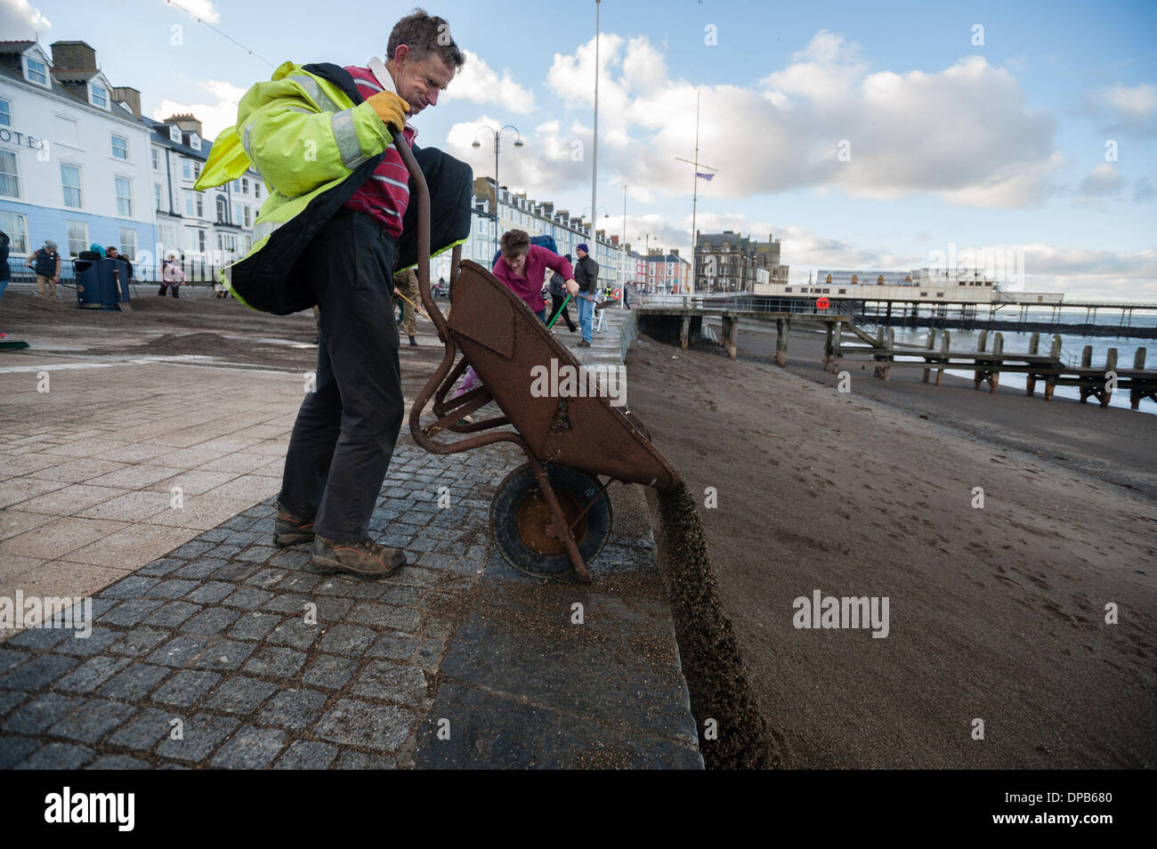 Aberystwyth, Wales, UK. 11th January 2014. The clean up operation ...