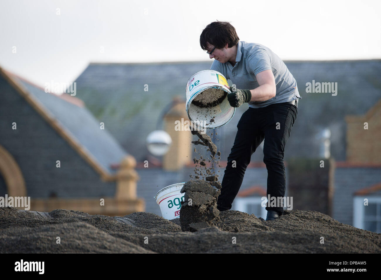 Aberystwyth, Wales, UK. 11th January 2014. The clean up operation ...