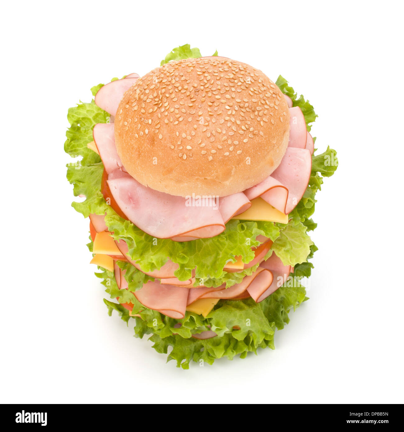 Big appetizing fast food sandwich with lettuce, tomato, smoked ham and ...