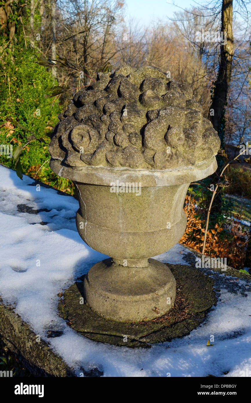 Weathered stone vase in the Palace Park Hoehenried, Lake Starnberg ...