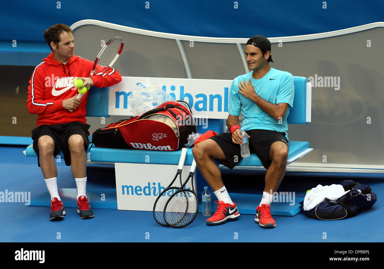 Melbourne, Australia. 11th Jan, 2014. Switzerland's Roger Federer (R ...