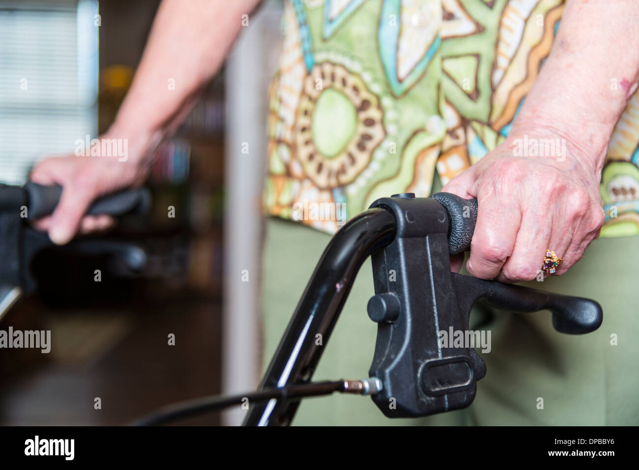 Woman using wheeled walker hi-res stock photography and images - Alamy