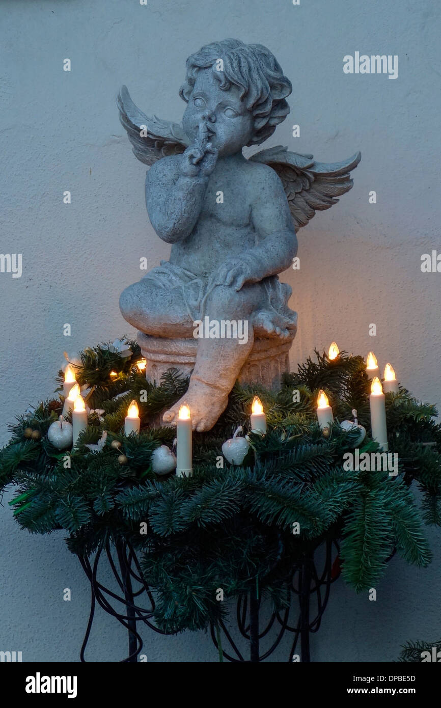 Angel figurine with lights in Advent Stock Photo - Alamy