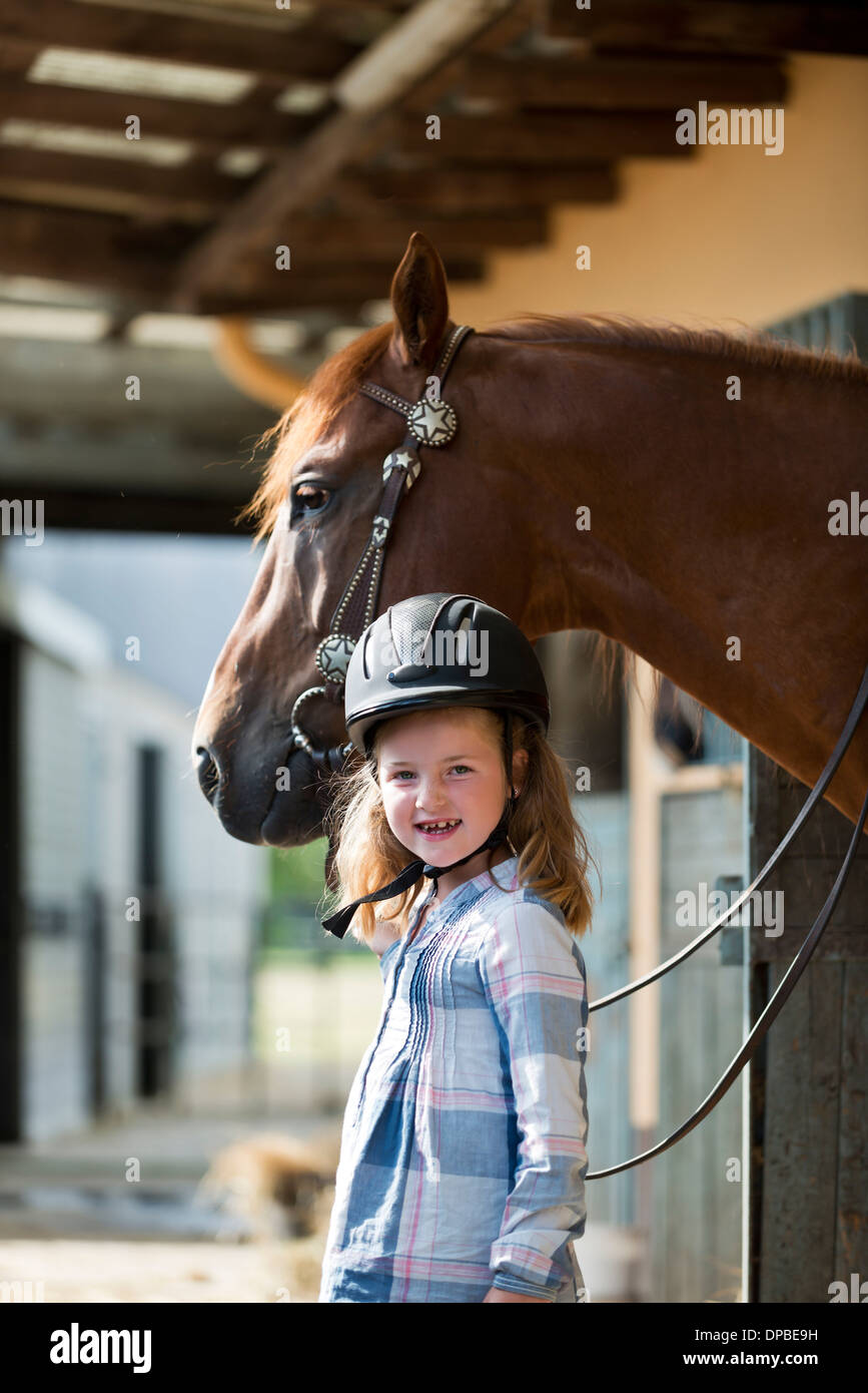 Little girl riding with her hobby horse hi-res stock photography and ...