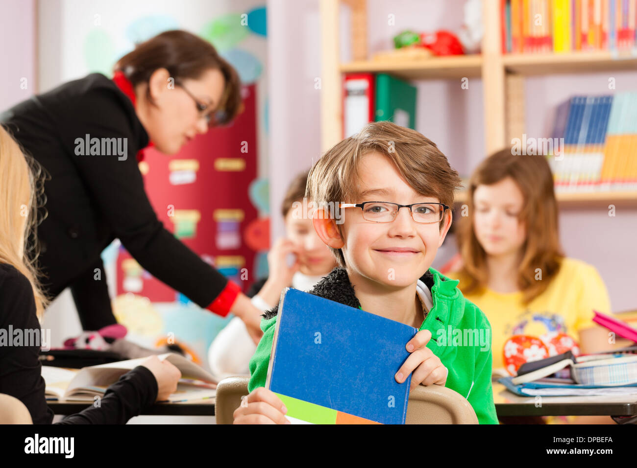 Education - Pupils and teacher learning at elementary or primary school ...