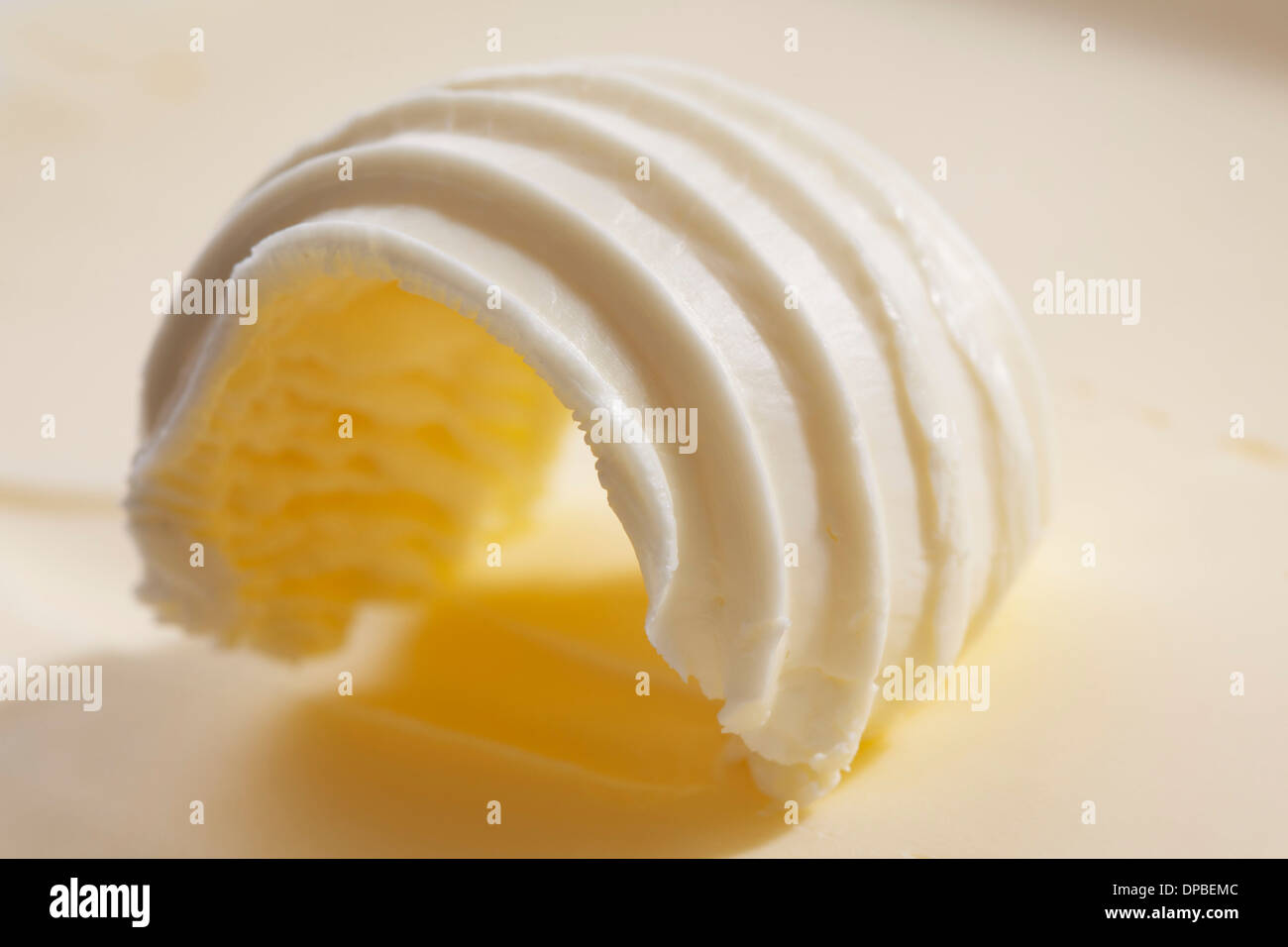Curl of butter, close up Stock Photo - Alamy