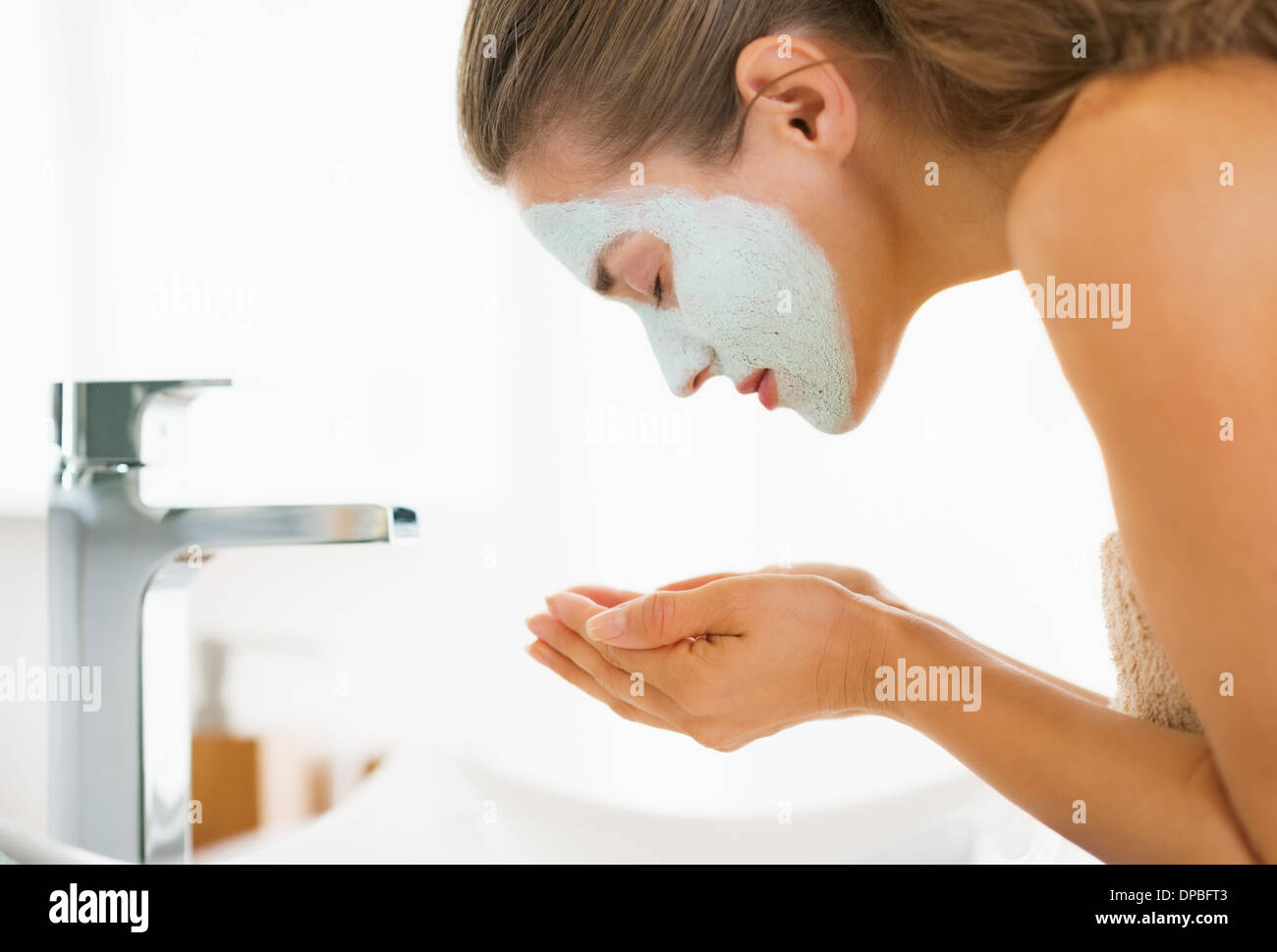 Woman washing face mask hi-res stock photography and images - Alamy