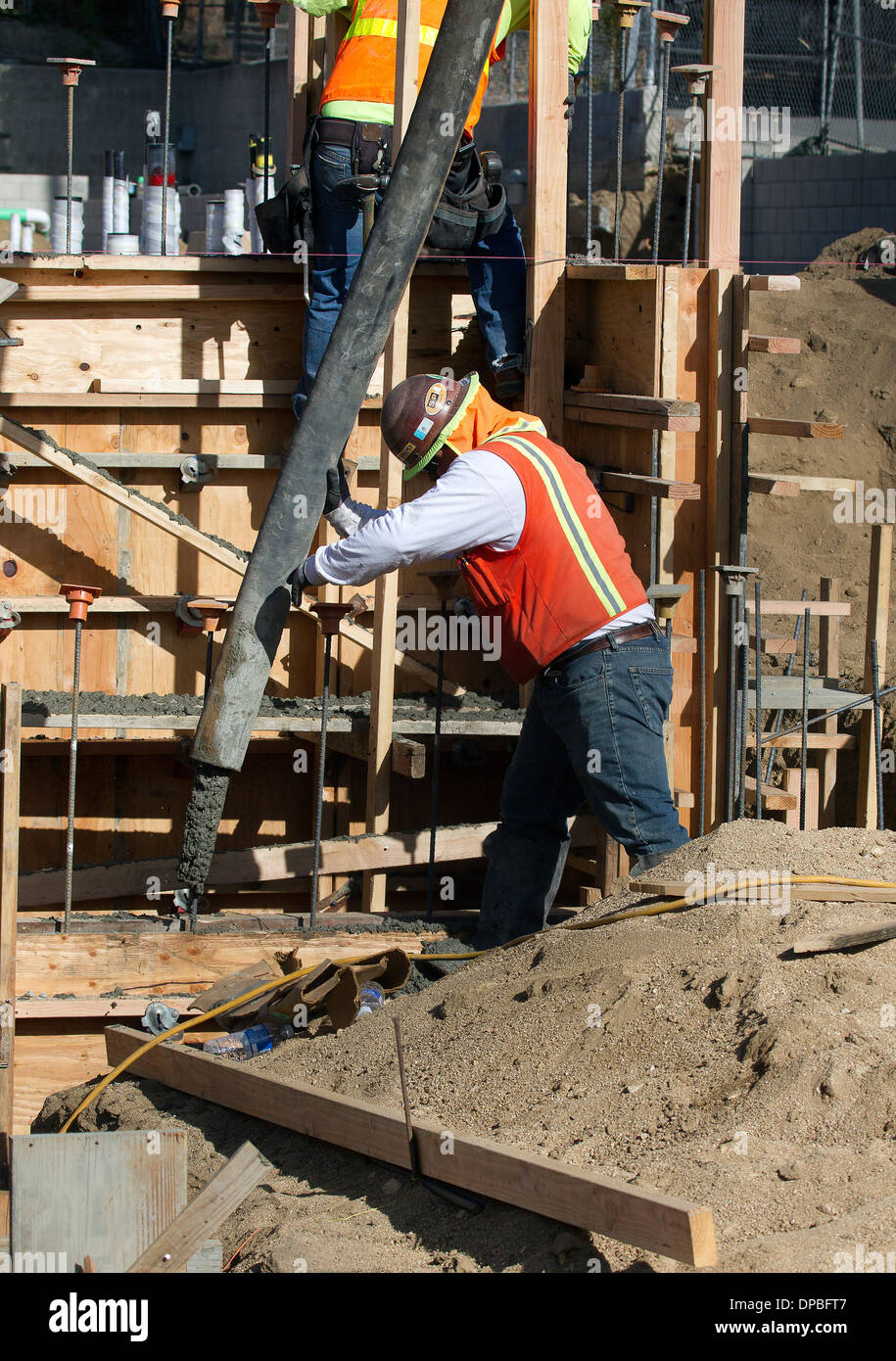 Construction Worker Pumping Concrete Stock Photo - Alamy