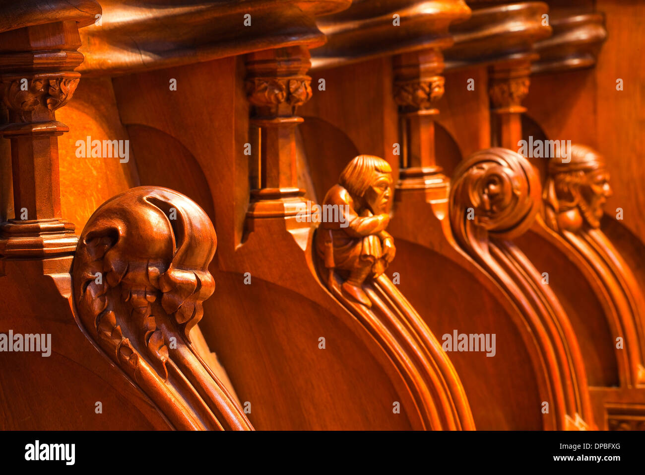 Carved wooden choir stalls in Basel Munster or Minster cathedral. The ...