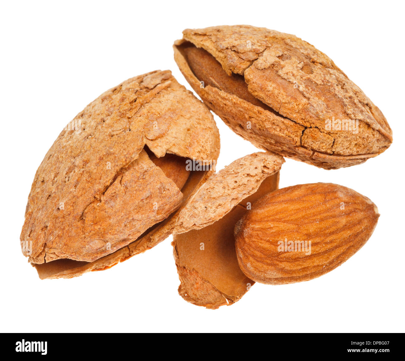 three fried almond nuts isolated on white background Stock Photo - Alamy