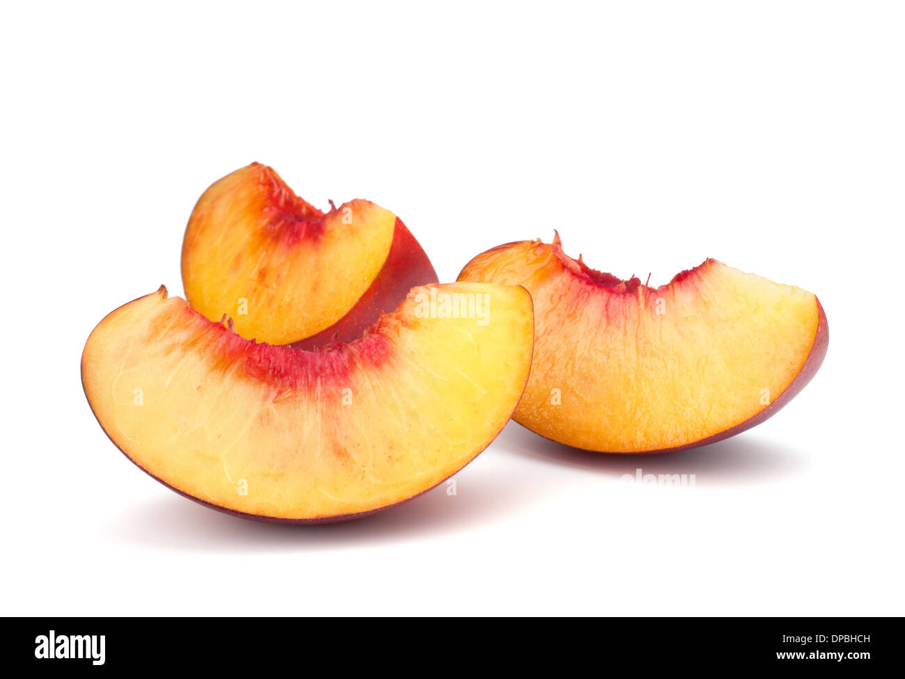 Nectarine fruit segments isolated on white background Stock Photo - Alamy