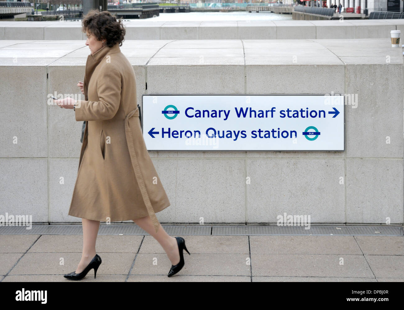 London, England, UK. Docklands / Canary Wharf. Sign giving directions ...