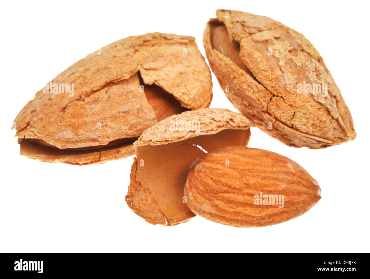 few fried almond nuts isolated on white background Stock Photo - Alamy