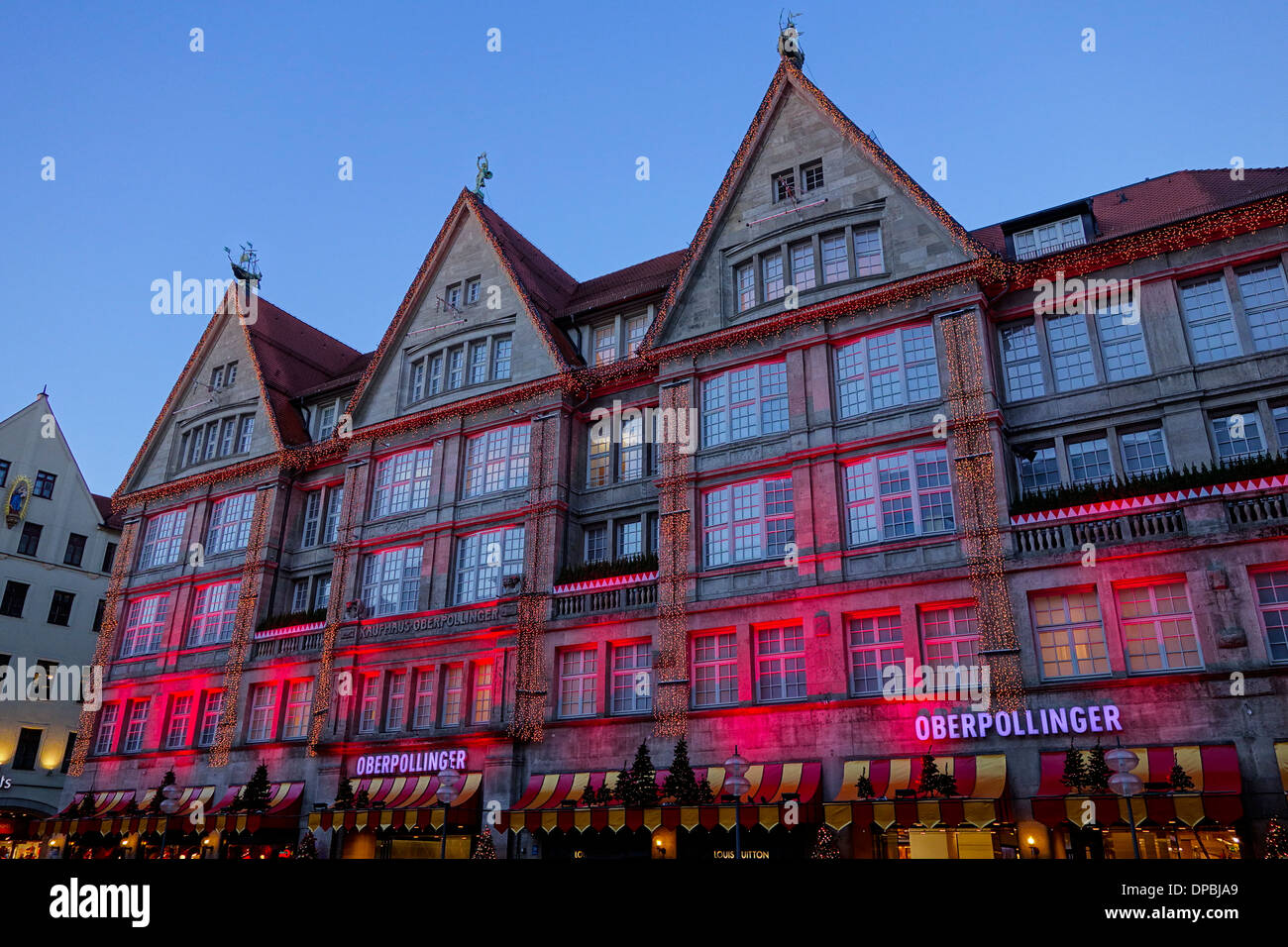 Christmas shopping, colorful illuminated facade of the department store ...