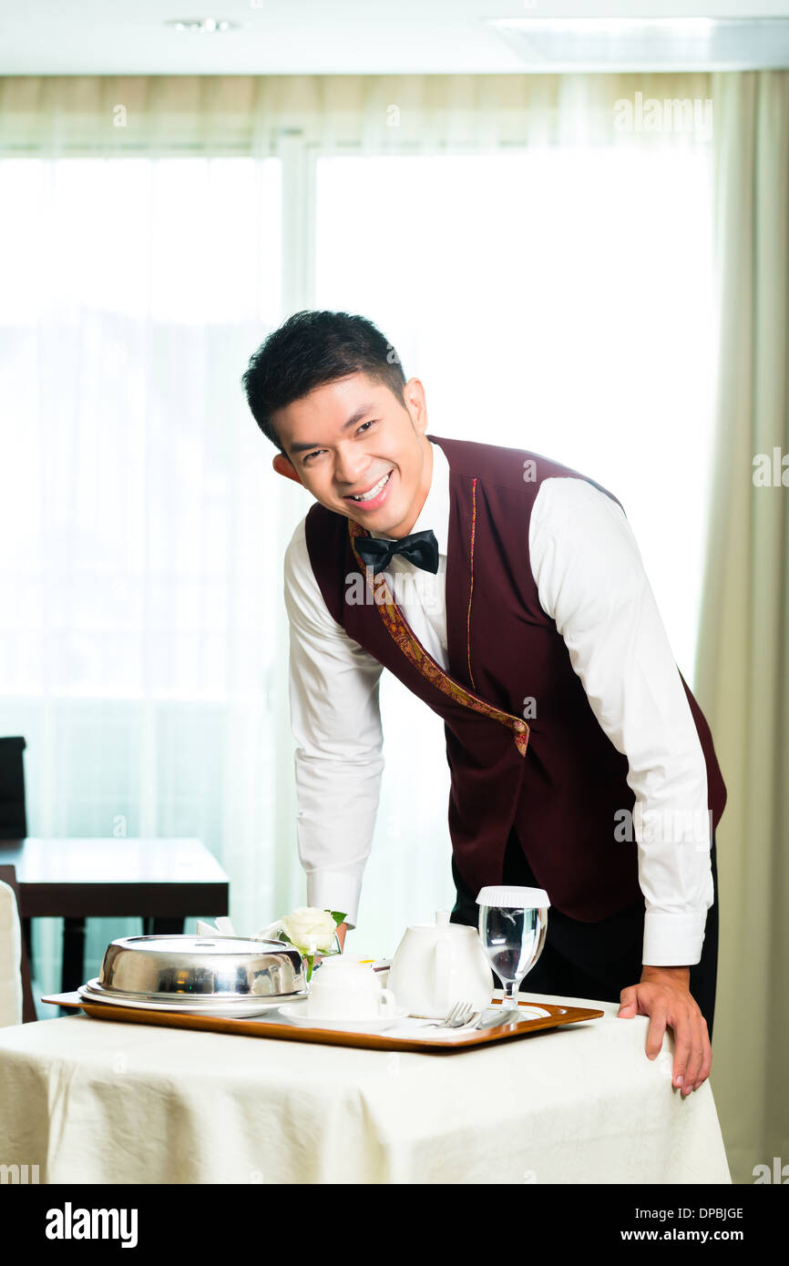 Room service waiter hi-res stock photography and images - Alamy