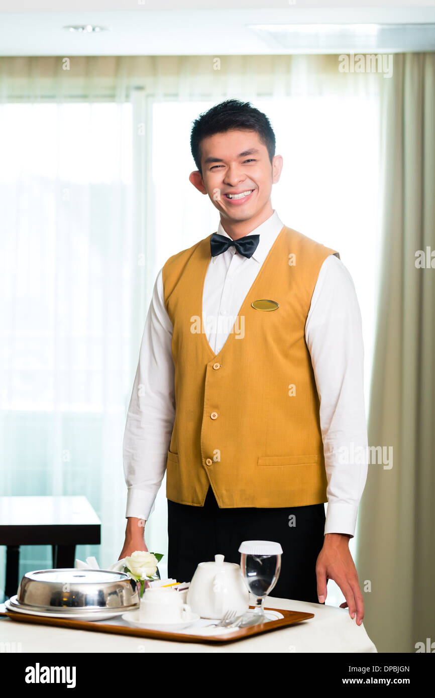 Room service waiter hi-res stock photography and images - Alamy