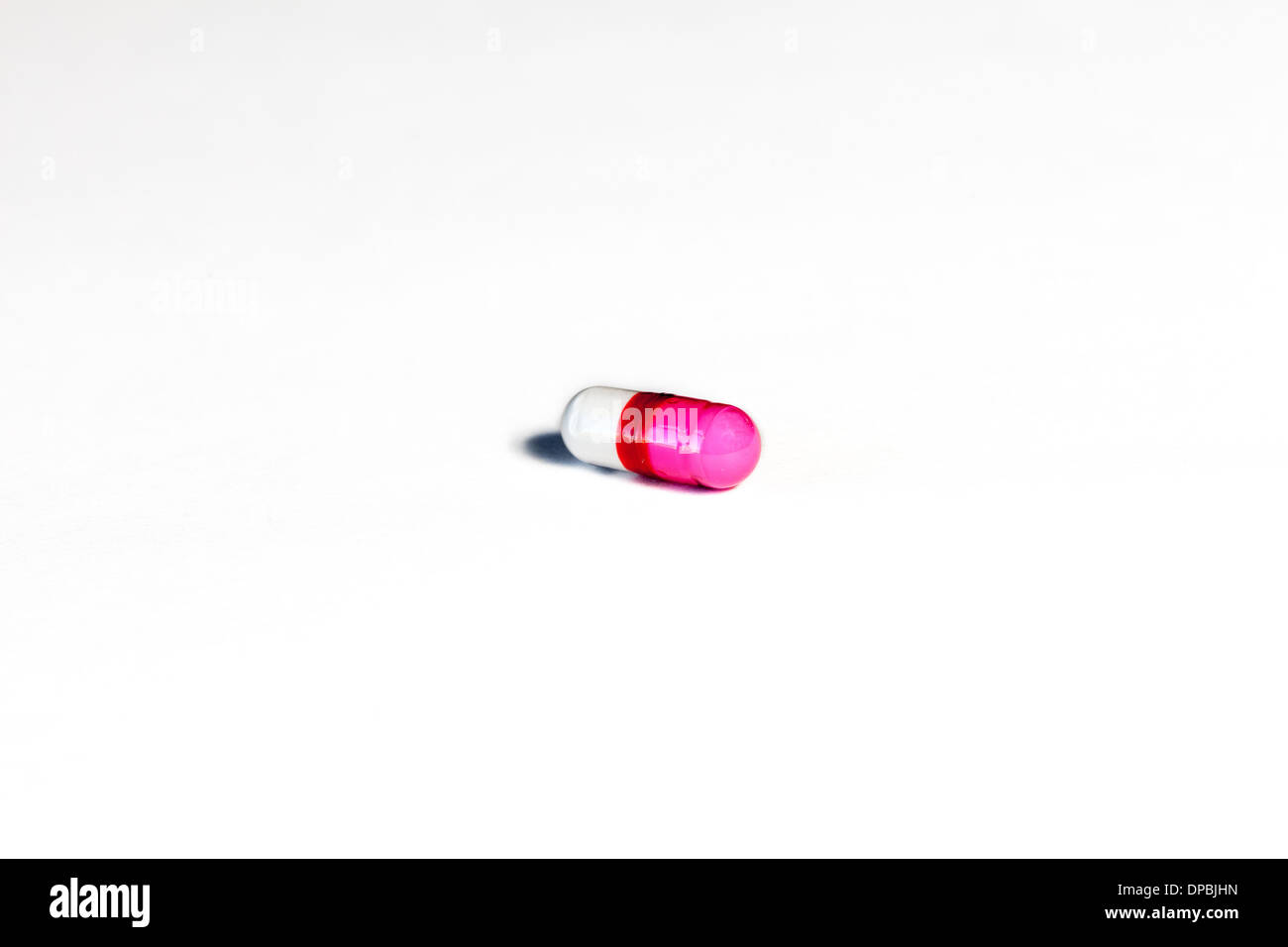 Medicine pink capsule hi-res stock photography and images - Alamy